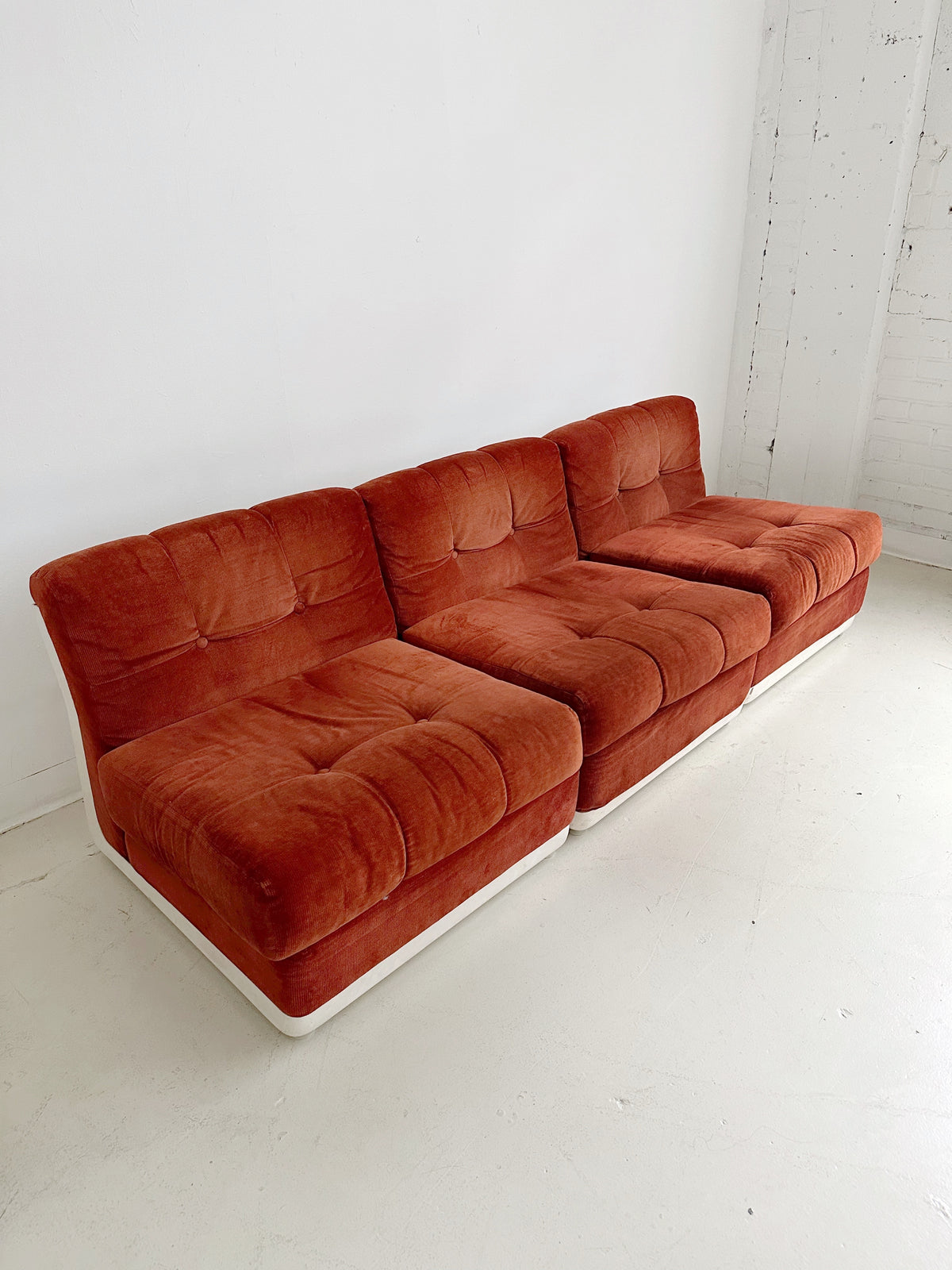3 SEATER BRICK RED MODULAR SOFA IN THE STYLE OF MARIO BELLINI, 70's ...